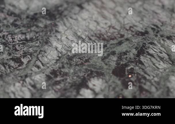 Close-up of dark stone surface showing natural lines and textures Stock ...