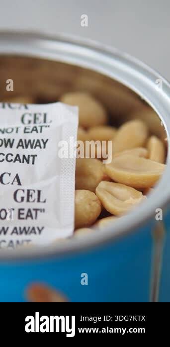 Peanuts are stored in a can with a warning pack inside for safety Stock ...