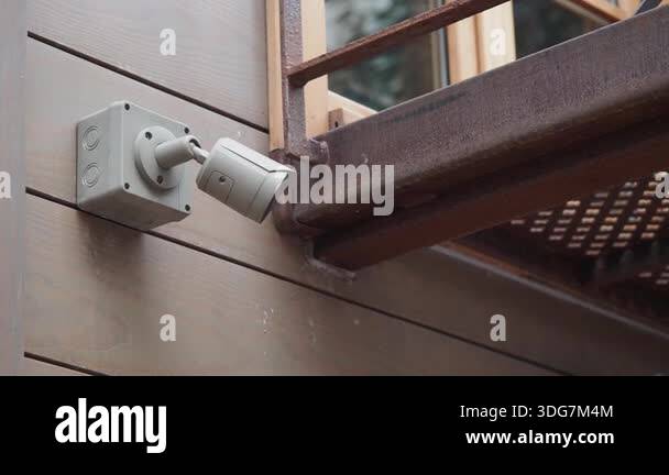 A camera is being set up on a railing outside a building Stock Video ...