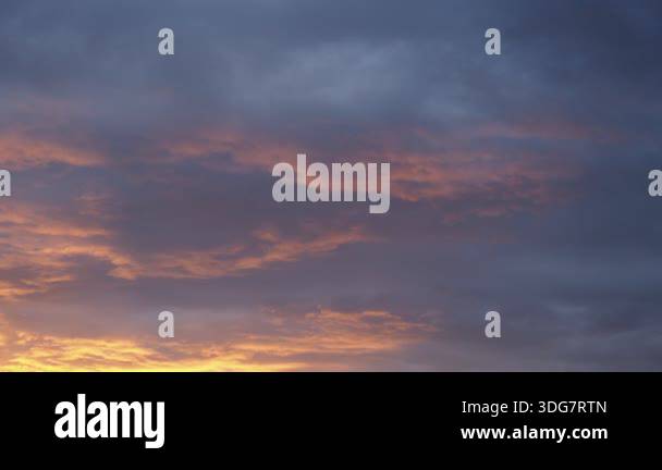 Watch as blue- pink sky transforms during sunset, showcasing a blend of ...