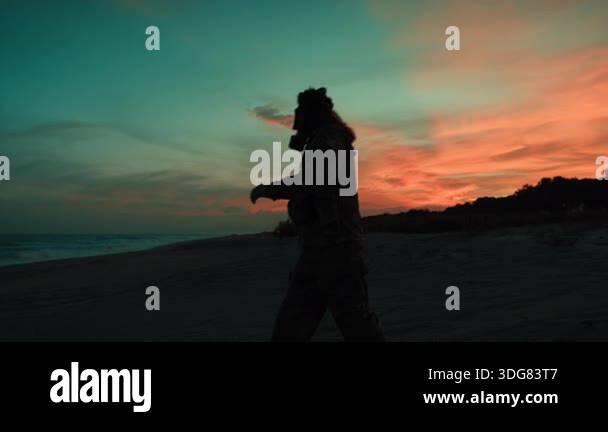 Man Soldier with gas mask walks on contaminated beach nuclear radiation ...