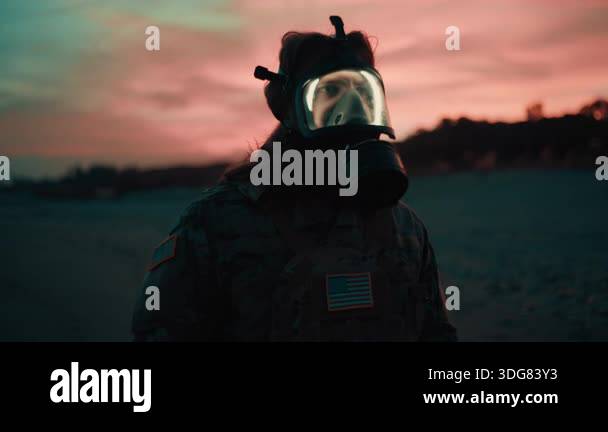 American Soldier Walks on Beach Wearing Gas Mask in Toxic Smog Stock ...