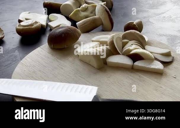 Close up of fresh cutted boletus mushroom on wooden cutting board on ...