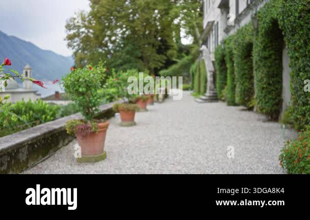 Lake como garden terrace path in soft bokeh defocused background garden ...
