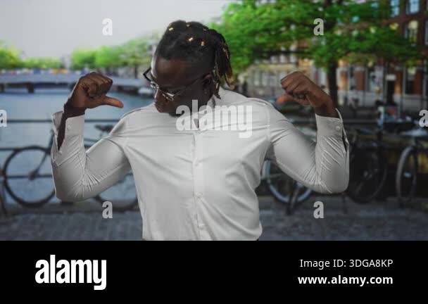 Man pointing thumbs to chest and hand on chest on street in amsterdam ...