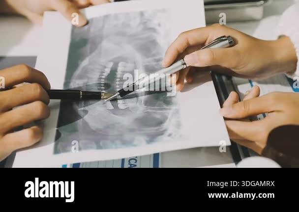 Medical team meeting analyzing blood test results in hospital ...