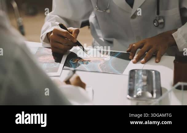 Medical team meeting analyzing blood test results in hospital ...
