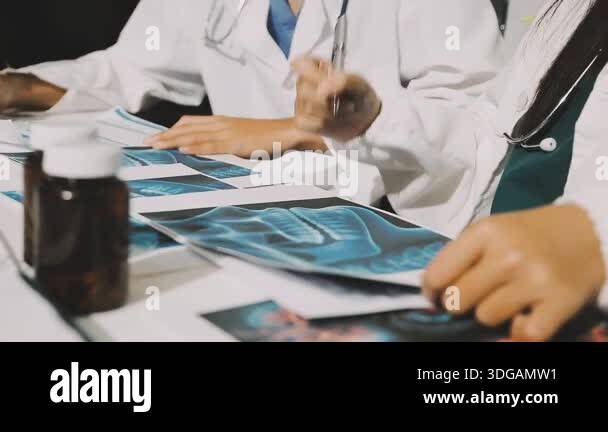 Medical team meeting analyzing blood test results in hospital ...