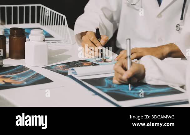 Medical team meeting analyzing blood test results in hospital ...