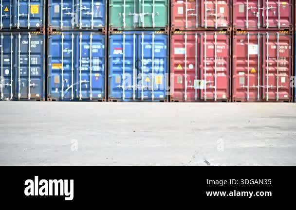 Logistic engineer worker man standing in shipping container yard and ...