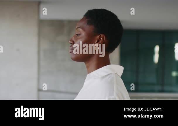 Side view of confident young Black businesswoman with short hair ...