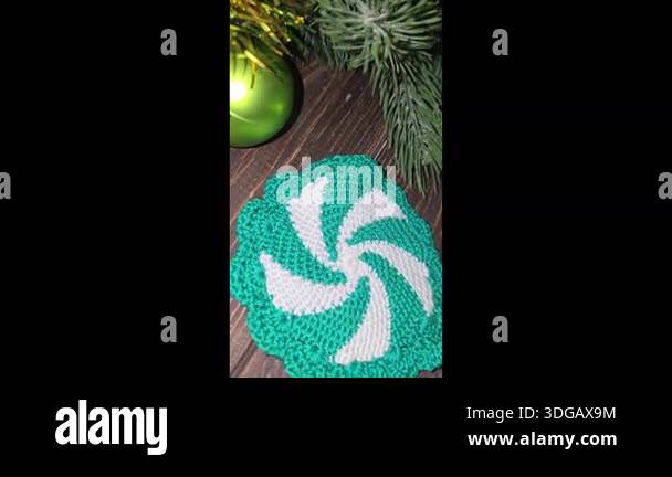 Handcrafted colorful candy-shaped potholders on a wooden background ...