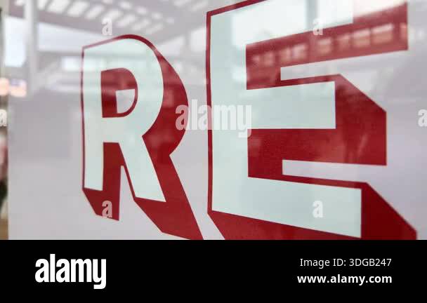 The word rebajas appearing letter by letter in a shop window Stock ...