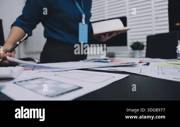 UI designer and UX developer brainstorm idea to design the application ...