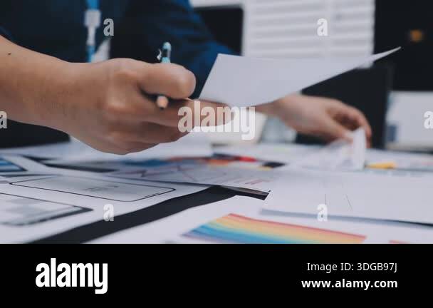 UI designer and UX developer brainstorm idea to design the application ...