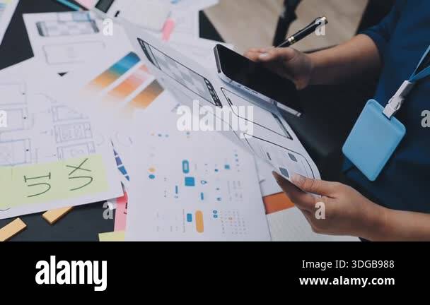 UI designer and UX developer brainstorm idea to design the application ...