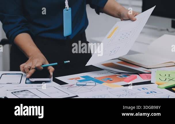 UI designer and UX developer brainstorm idea to design the application ...