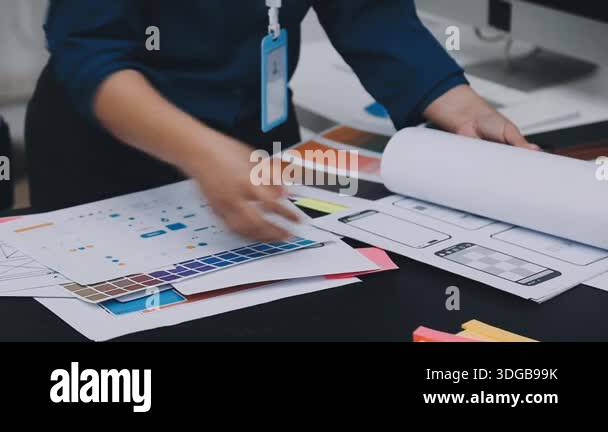 UI designer and UX developer brainstorm idea to design the application ...