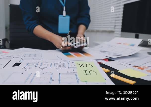 UI designer and UX developer brainstorm idea to design the application ...