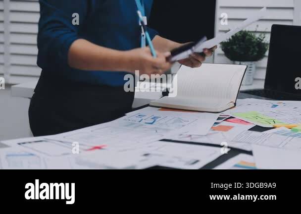 UI designer and UX developer brainstorm idea to design the application ...