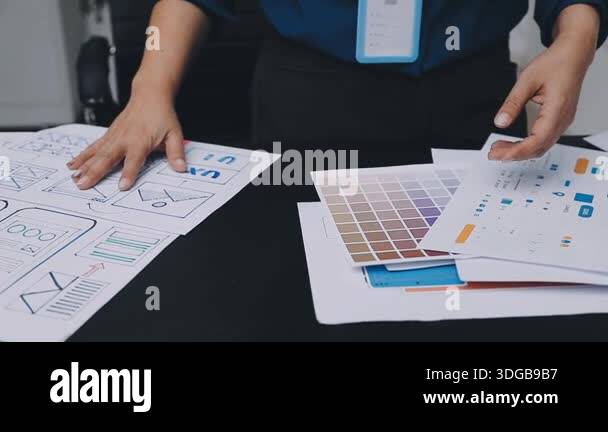 UI designer and UX developer brainstorm idea to design the application ...