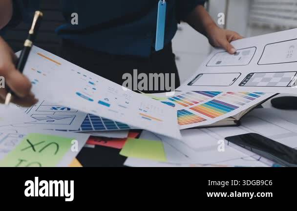 UI designer and UX developer brainstorm idea to design the application ...