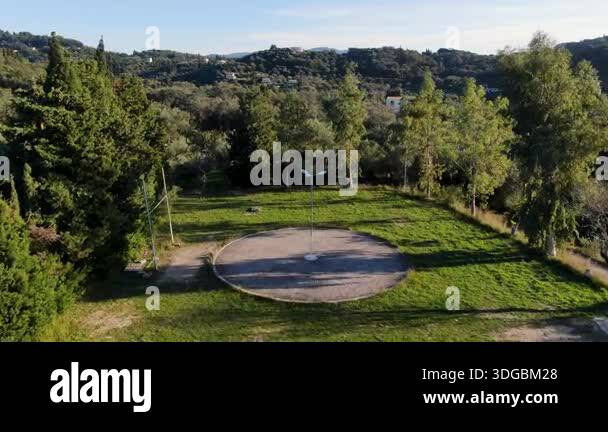 Aerial View of Circular Paved Concrete Area with Light Pole Surrounded ...