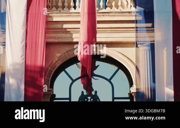 French city hall entrance with tricolor flags and reflection of a ...
