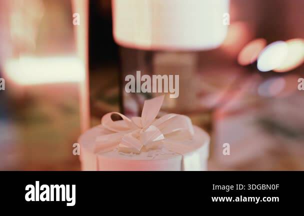 Golden Christmas baubles hanging from a structure alongside a suspended ...