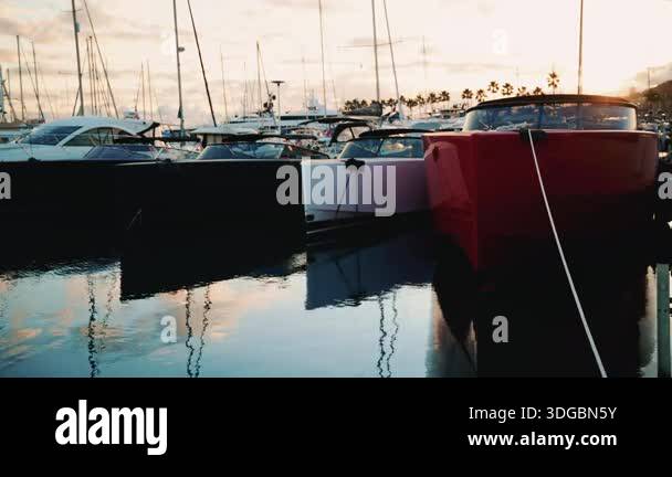 Close up of red and white motorboats moored side by side at a dock ...