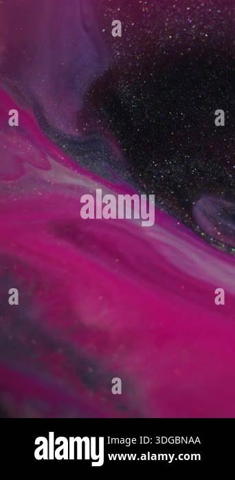 Vertical video. Flowing liquid. Shimmer ink. Defocused pink purple neon ...
