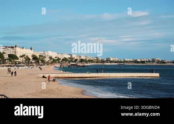 Wide view of the sandy beach and calm Mediterranean Sea along Cannes ...