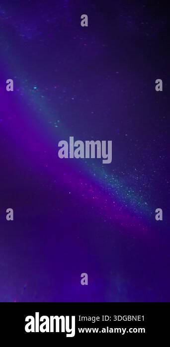 Vertical video. Neon blend. Shiny ink flow. Defocused purple green blue ...