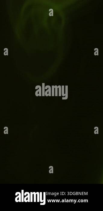 Vertical video. Paint vapor. Blend flow. Defocused green neon color ...
