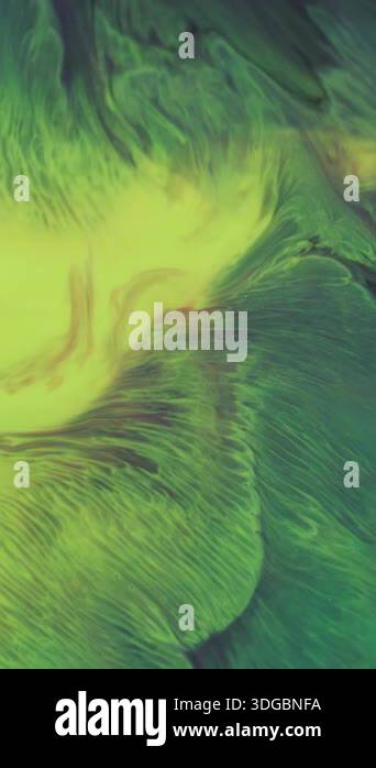 Vertical video. Ink splatter. Drip texture. Defocused yellow blue color ...