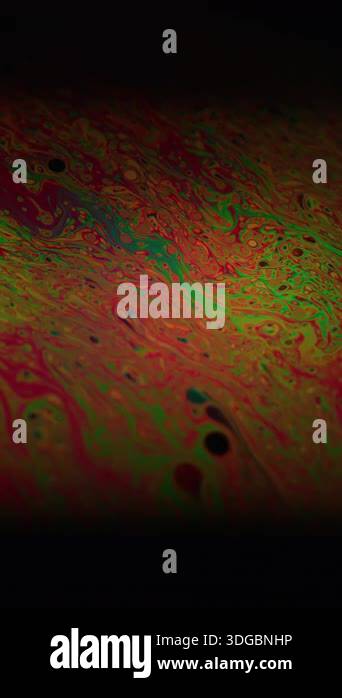 Vertical video. Holographic swirl. Gasoline paint. Colorful soap stream ...