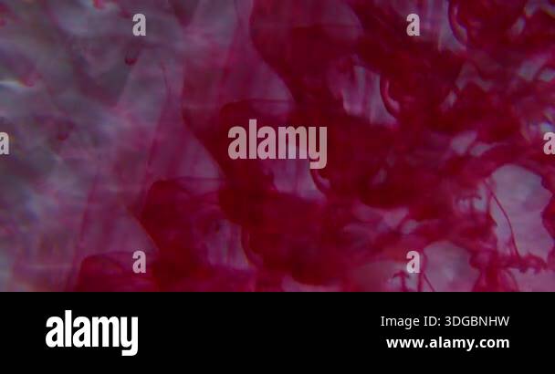 Paint splash defocused. Mix smoke. Red pigment mist flowing in blue ...