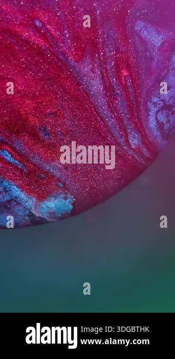 Vertical video. Ink pour. Colorful mix. Defocused red purple neon round ...