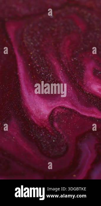 Vertical video. Shiny paint spill. Glitter fluid wave. Defocused pink ...