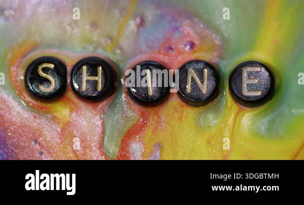 Shine word. Paint drip. Defocused yellow blue orange color glitter ...