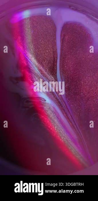 Vertical video. Round ink. Abstract neon. Defocused purple red green ...