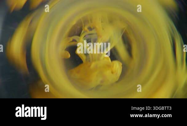Paint drop defocused. Smoke whirl. Yellow color fume trickles floating ...