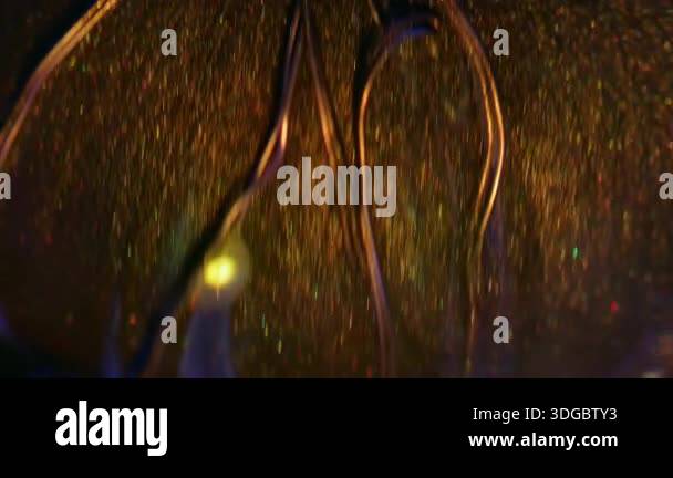 Fluorescent paint. Light garland. Defocused golden yellow blue color ...