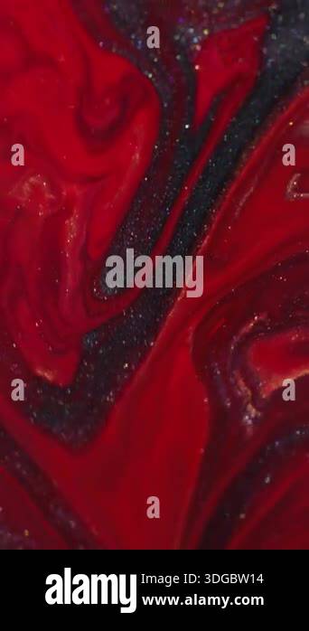 Vertical video. Paint drip. Ink water. Defocused red orange color ...