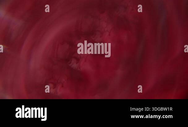 Smoke flow defocused. Paint drip. Red color liquid swirl in prism lens ...