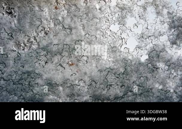 Close up view of an icy or frosted surface with fine texture and soft ...