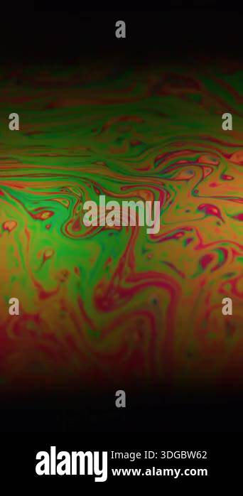 Vertical video. Psychedelic dye flow. Paint mix. Multicolor gasoline ...