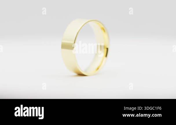 Golden ring rotating isolated on white. Plain wide wedding ring in ...