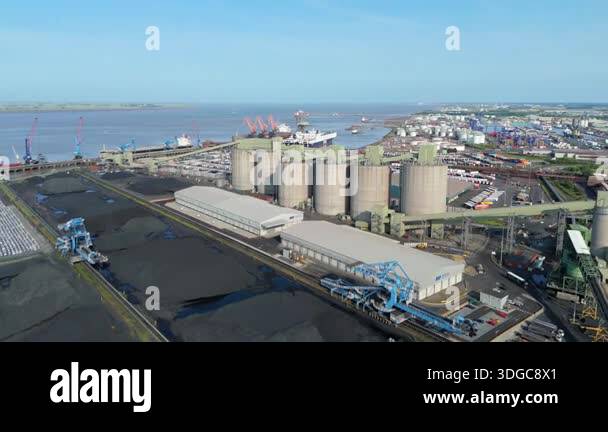 Aerial drone view of huge coal and iron ore storage depot, piles of ...