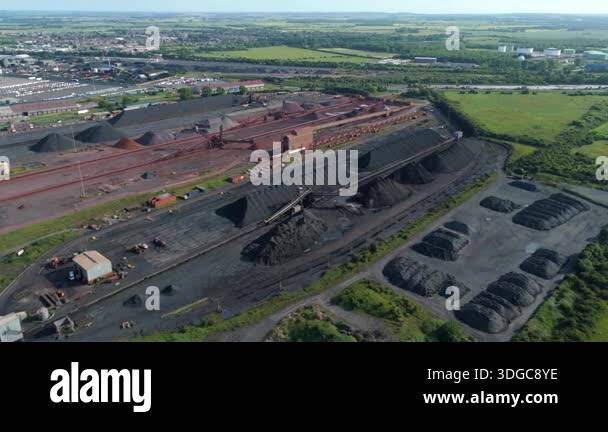 Aerial drone view of huge coal and iron ore storage depot, piles of ...